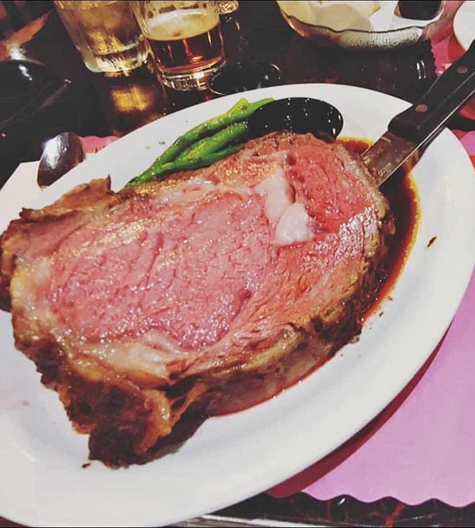 Behold the star attraction: prime rib so perfectly pink it should have its own fan club. That seasoned crust is the beef equivalent of a perfect album opener.
