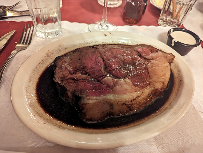 Prime rib so perfectly pink it could make a vegetarian question their life choices. That au jus is practically liquid gold.