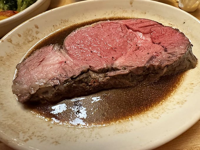 This prime rib isn't just dinner; it's a religious experience. Perfectly pink, juicy, and swimming in its own glorious juices.