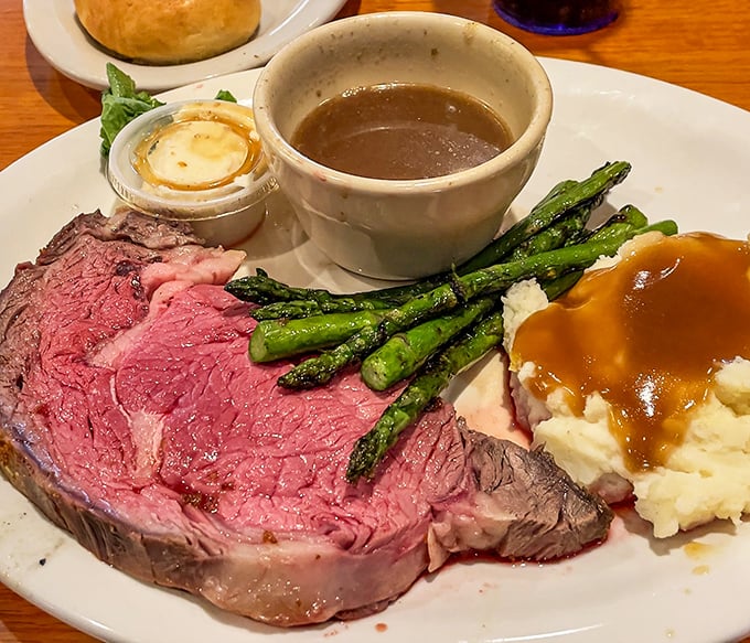 This prime rib isn't just dinner; it's a masterpiece of meat artistry with that perfect pink center that makes carnivores weak at the knees.