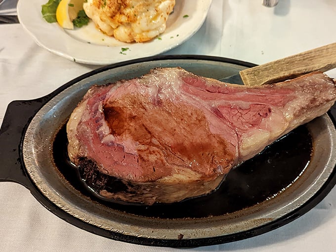 Behold the prime rib in all its rosy, juicy glory. This isn't just dinner; it's a carnivorous masterpiece that makes vegetarians question their life choices.