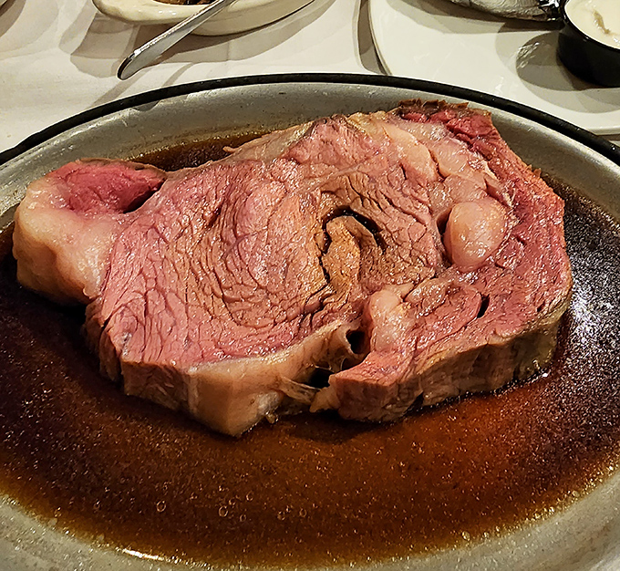 This isn't just prime rib; it's a masterpiece of meat &ndash; perfectly pink, swimming in savory jus, waiting to make your taste buds dance.