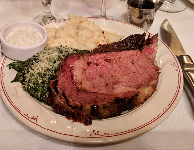 Behold the star of the show: prime rib so perfectly pink it makes flamingos look pale, accompanied by creamed spinach and mashed potatoes.