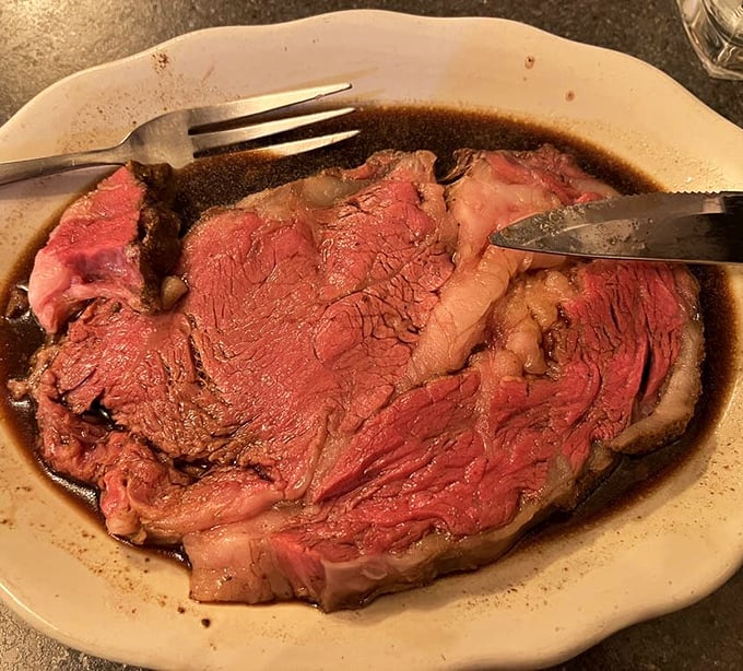 The prime rib isn't just served&mdash;it's presented like the celebrity it is. Swimming in savory au jus, this perfectly pink masterpiece makes vegetarians question their life choices. 