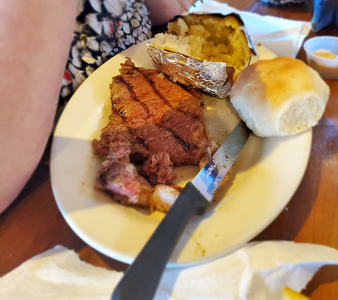 Prime rib that makes you question every steak you've ever eaten before. Perfectly pink, impossibly tender, with a baked potato sidekick that's equally impressive.