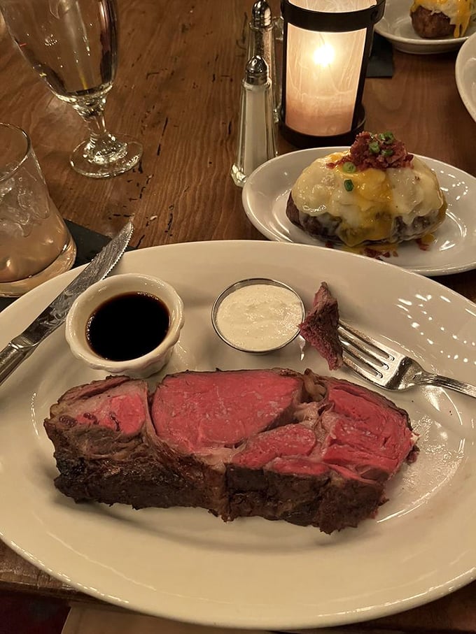 This prime rib isn't just dinner; it's a life event with its perfect pink center and companions of au jus and horseradish.