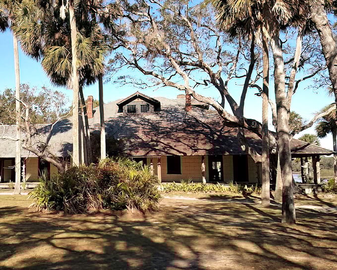 The historic hunting lodge stands as a testament to Old Florida elegance, surrounded by ancient oaks draped in Spanish moss.