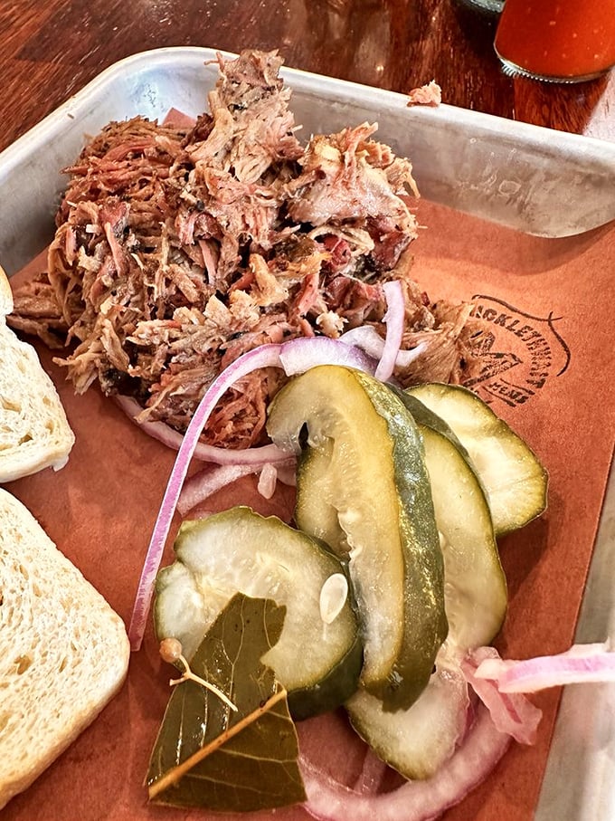 Pulled lamb that makes you question why you've wasted years eating other proteins. Those pickles aren't just garnish&mdash;they're essential acid relief.