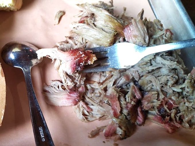 Pulled pork so tender it practically surrenders to your fork. That pink smoke ring is the barbecue equivalent of a Michelin star.