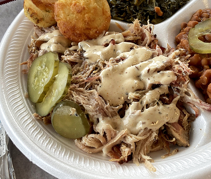 This isn't just pulled pork &ndash; it's a masterclass in smoke and patience, served with pickles that provide the perfect tangy counterpoint.