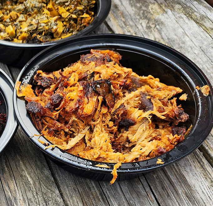 Pulled pork that looks like it's been coaxed apart by angels&mdash;tender strands of smoky heaven waiting for their sauce baptism.