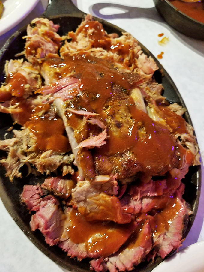 Pulled pork so tender and glistening with sauce, it's practically posing for its BBQ glamour shot. This isn't food; it's edible artwork.