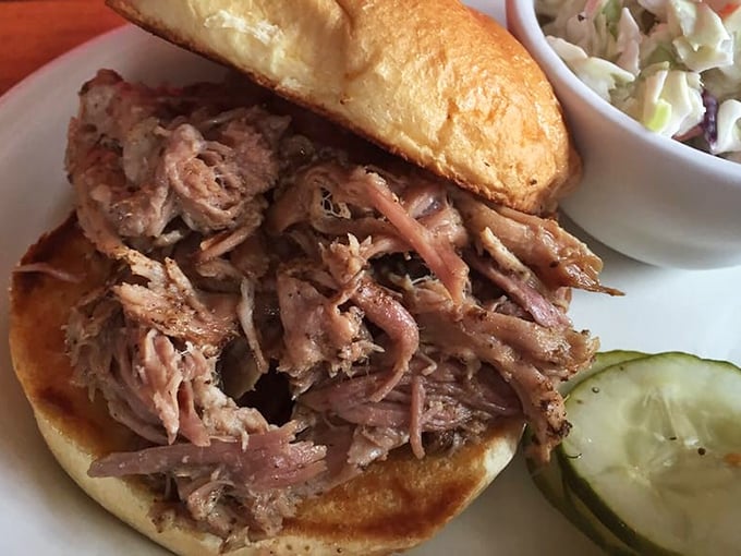 Behold the star of our show: tender pulled pork piled high, with just enough bark to make a BBQ purist weep with joy.