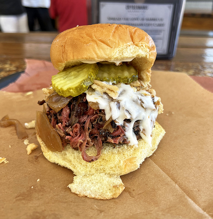 Meet the sandwich that launched a thousand road trips. Tender pulled pork, pickles, and sauce creating a perfect harmony that makes taste buds sing.