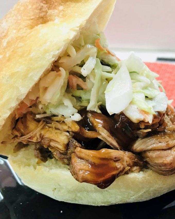 This pulled pork sandwich isn't just topped with coleslaw&mdash;it's crowned with it. Royalty among lunch options.