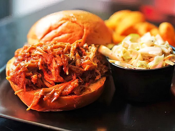 The star of the show: pulled pork so tender it practically surrenders to your fork, crowned with crisp jalape&ntilde;o slaw.