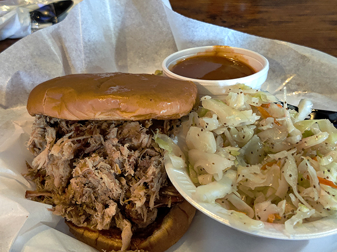 This pulled pork sandwich isn't just food, it's architecture &ndash; a carefully constructed monument to smoke, time, and Georgia know-how.