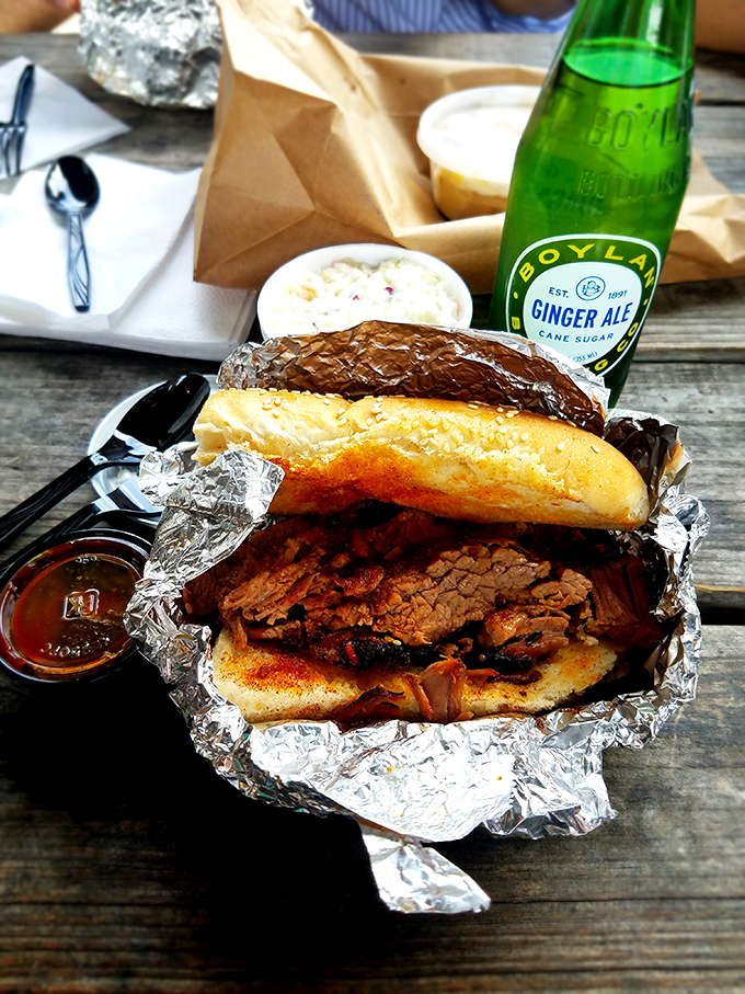 Brisket sandwich perfection: tender meat, soft bun, and that essential sauce. Pair with a craft ginger ale for a lunch that ruins all other lunches.