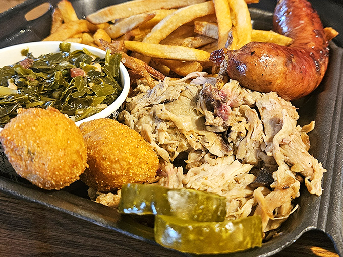 Pulled pork that doesn't just fall apart—it surrenders with dignity. Those collard greens and hush puppies aren't sides; they're supporting actors deserving their own spotlight.