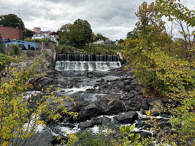 The Quinebaug River cascades through town, providing a soundtrack of rushing water that real estate developers would charge extra for elsewhere.