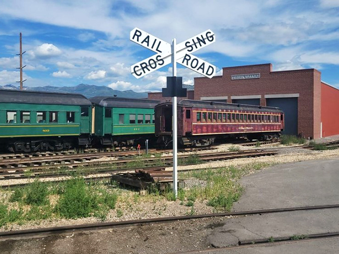 Classic Americana at its finest&mdash;where railroad crossing signs stand sentinel over tracks that have witnessed decades of comings and goings.