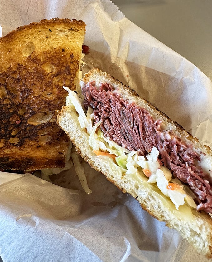 Behold the Reuben in its natural habitat &ndash; perfectly grilled rye embracing corned beef and sauerkraut in a dance as old as delicatessens themselves.
