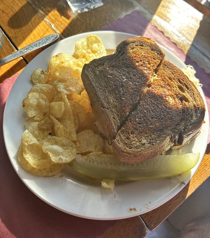 This isn't just a Reuben sandwich&mdash;it's architecture with purpose. Crispy edges, hearty filling, and chips that crunch loud enough to turn heads.