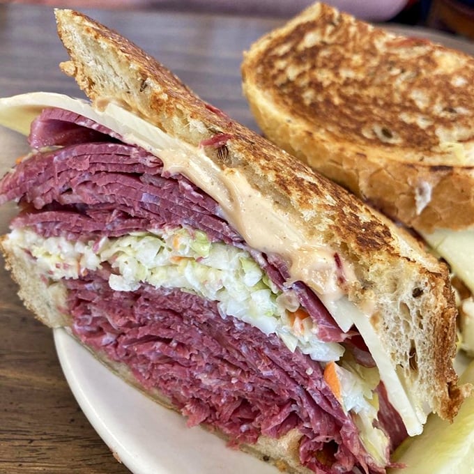 Behold the Reuben in its natural habitat &ndash; a mountain of corned beef that requires both hands and possibly a building permit.