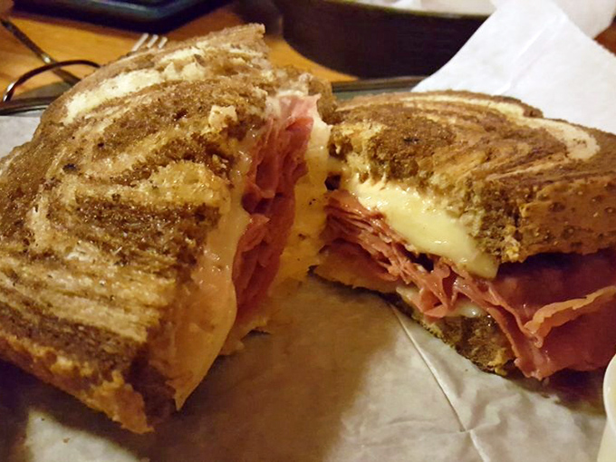 The legendary Reuben – where corned beef, Swiss cheese, and sauerkraut perform a perfect culinary tango between two slices of grilled rye bread.