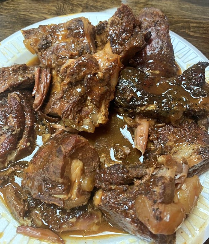 These rib tips aren't just food&mdash;they're a glistening, sauce-lacquered testament to Memphis' barbecue mastery. Napkins required, regrets impossible.