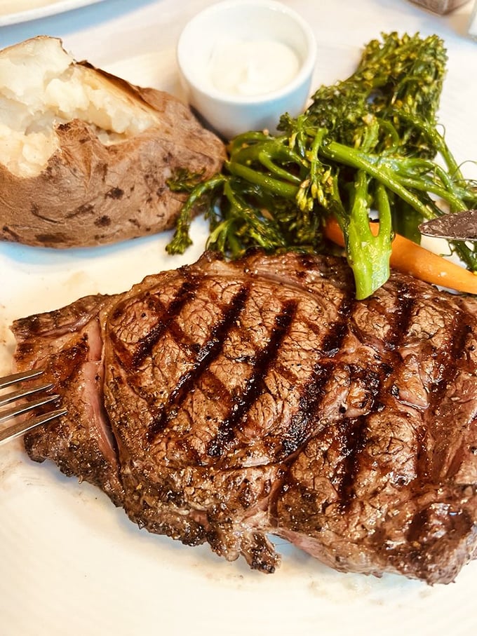 This isn't just a steak; it's a masterpiece of marbling. The ribeye arrives with perfect grill marks and a side of "where have you been all my life?"