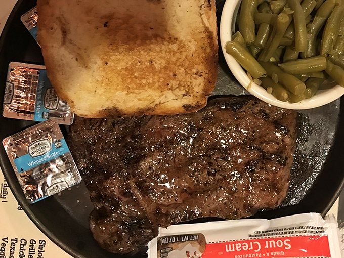 Behold the star of the show: a perfectly seared ribeye with just the right amount of glistening goodness. Poetry on a plate.