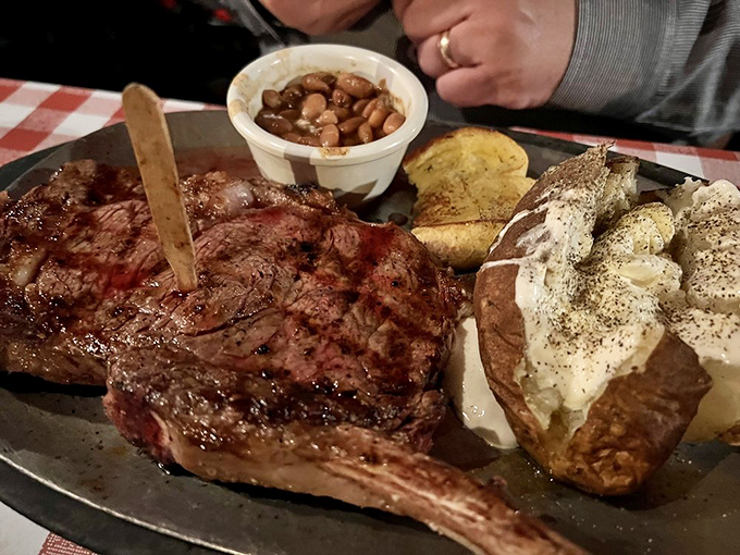 Behold the star of the show &ndash; a perfectly seared ribeye that could make a vegetarian question their life choices, served with a loaded baked potato that's practically a meal itself.