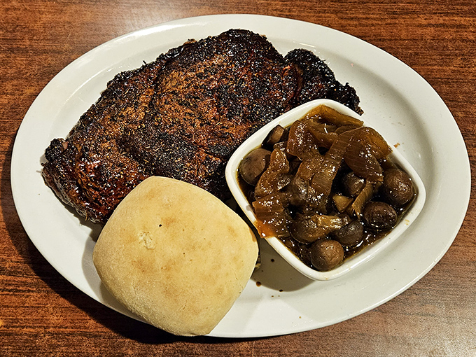 This blackened ribeye isn't just a steak; it's a masterclass in crust development with a side of mushrooms that didn't come from a can. 