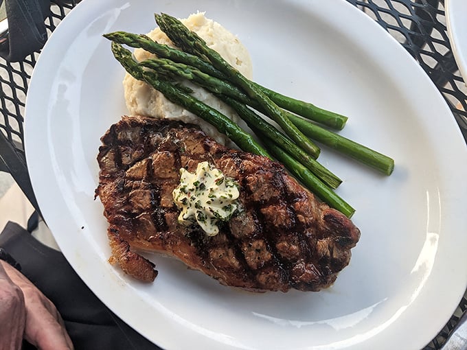 The star of the show! This perfectly grilled ribeye with herb butter could make a vegetarian reconsider their life choices.