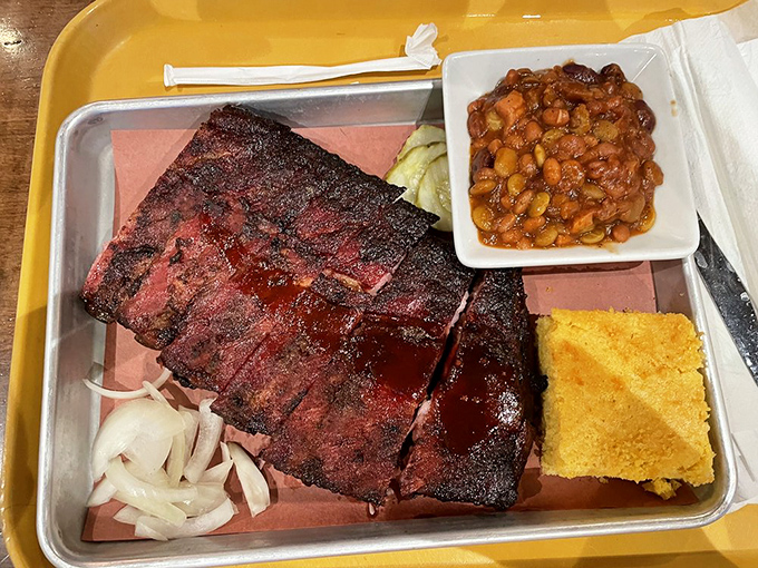 These ribs don't just fall off the bone; they practically leap into your mouth with smoky enthusiasm.