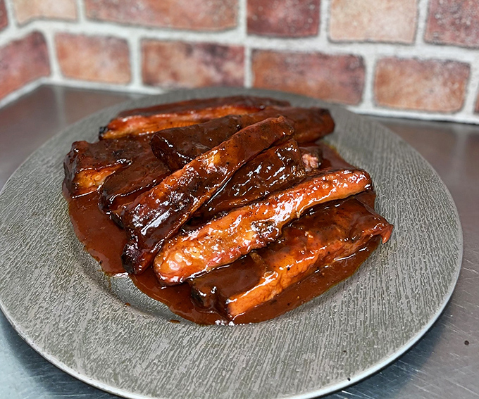 These ribs glisten with sauce like they're auditioning for a food magazine cover, but they're not here to look pretty&mdash;they're here to change your life.