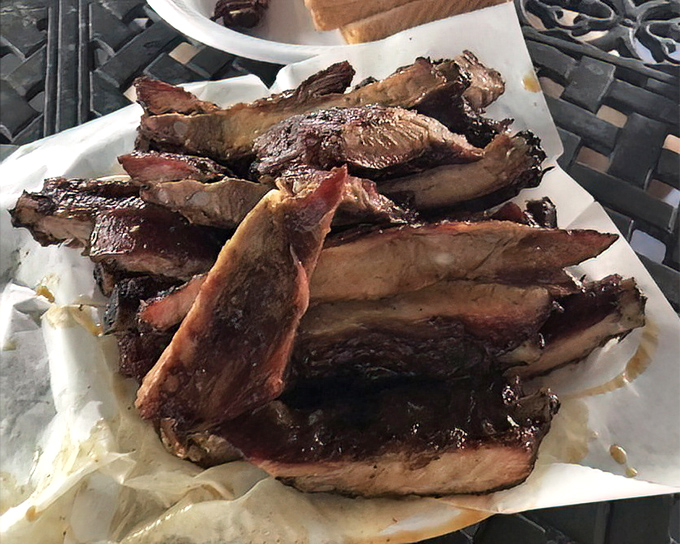 These ribs aren't just smoked, they're transformed &ndash; that bark, that pink smoke ring, that glistening sauce. Poetry on a bone.