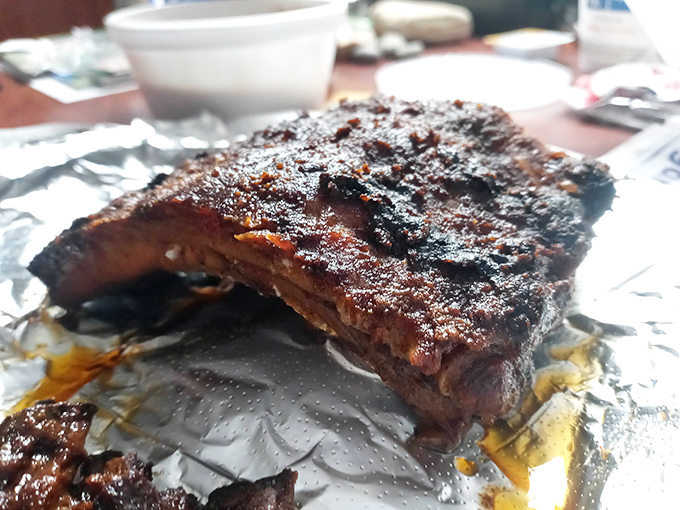 These ribs don't just fall off the bone—they negotiate a graceful departure. The bark on these beauties tells stories of patience and wood smoke.
