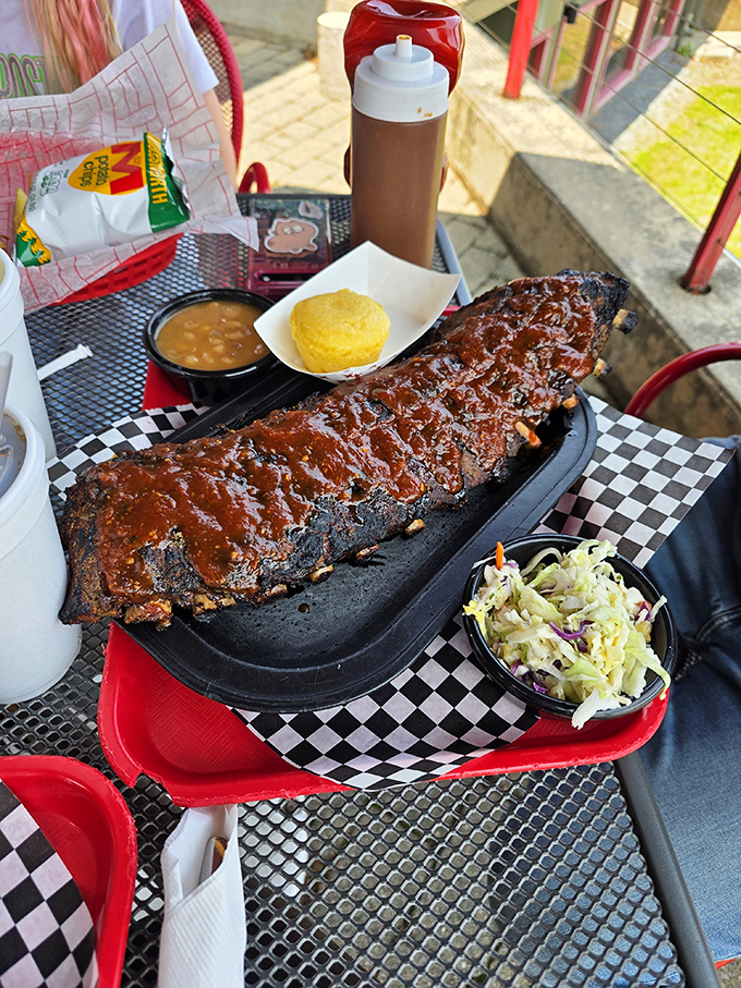 Not so much falling off the bone as clinging to it with dignity &ndash; these ribs have the perfect bark, smoke ring, and sauce-to-meat ratio.