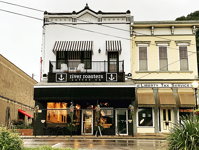 River Roasters Coffee Co. proves small towns understand good coffee too. The striped awnings and balcony seating invite you to slow down and savor both the brew and the view.