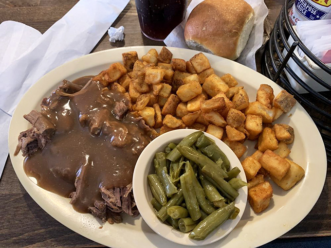 That famous roast beef, swimming in rich gravy alongside crispy potatoes and green beans&mdash;a holy trinity of comfort that speaks directly to your soul.