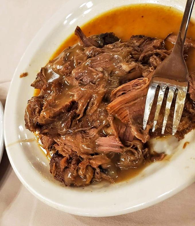 Fork-tender roast beef swimming in rich, savory gravy. The kind of dish that makes you want to hug whoever's in the kitchen.