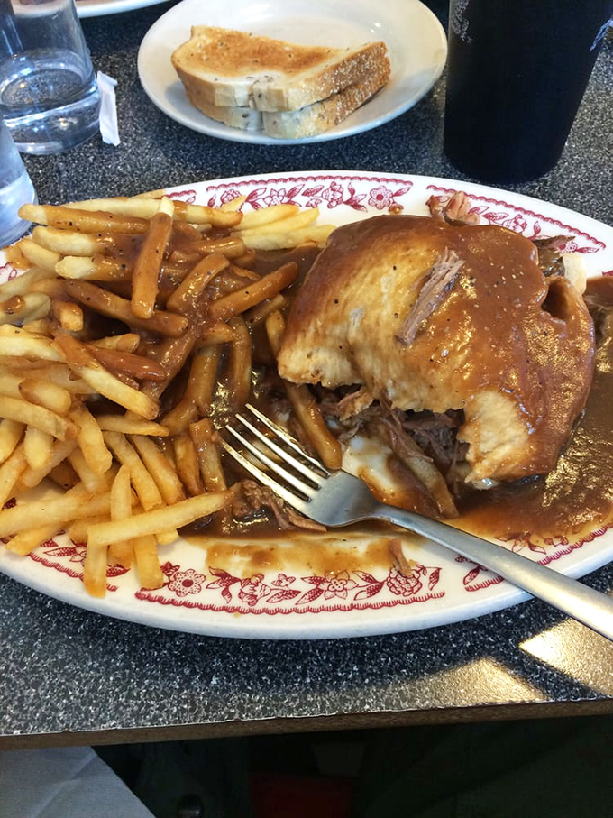 This isn't just roast beef&mdash;it's a comfort food masterpiece swimming in rich gravy alongside perfectly crisp fries. Grandma would approve, then ask for the recipe.