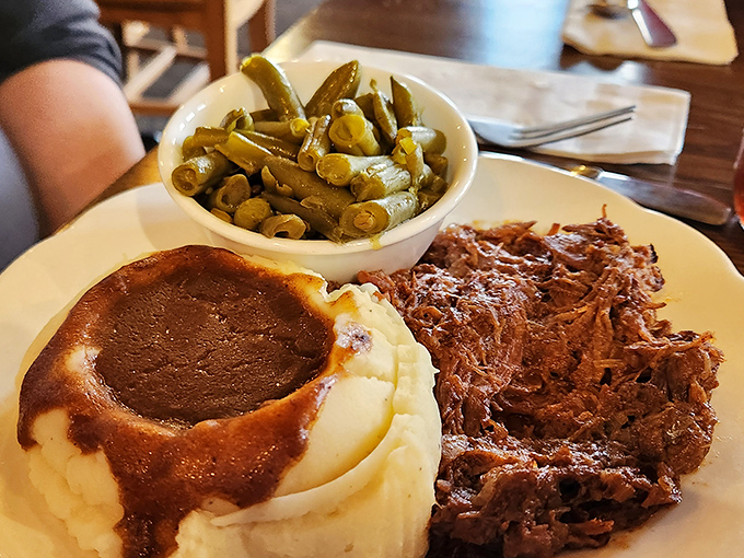 Behold the star attraction: fork-tender roast beef swimming in savory gravy alongside creamy mashed potatoes. Grandma would approve&mdash;and ask for seconds.