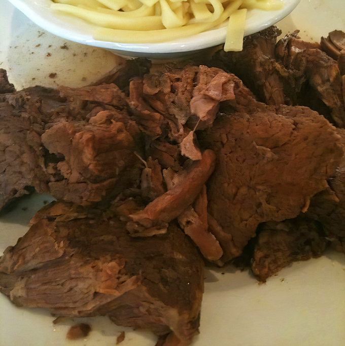 Behold the star attraction: roast beef so tender it practically surrenders to your fork. This isn't just meat&mdash;it's a masterclass in patience and technique.