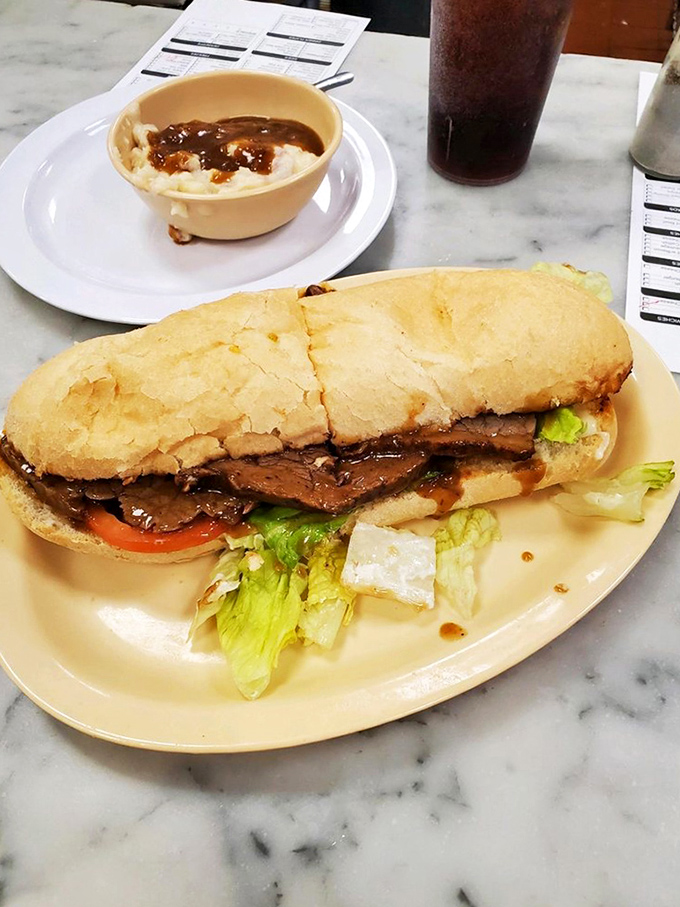 That's not just a roast beef po'boy&mdash;it's a masterclass in sandwich architecture where gravy meets French bread in a beautiful, messy romance.