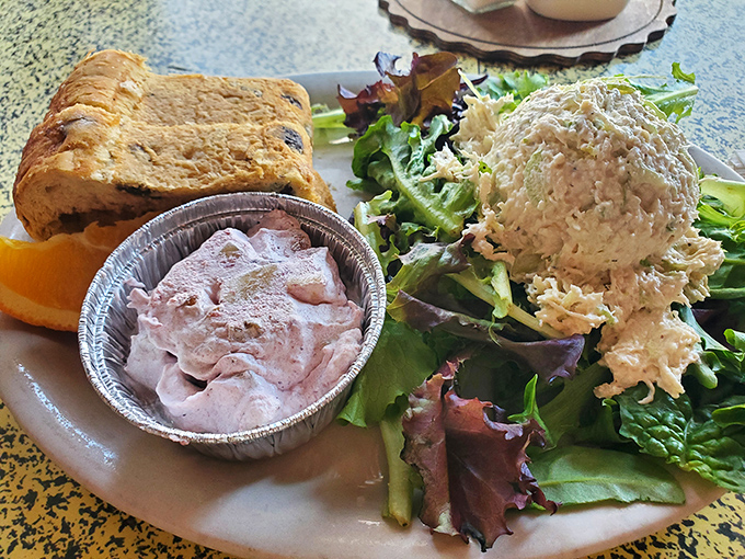 Chicken salad that doesn't just sit on the plate&mdash;it performs. Paired with fresh greens and that signature cinnamon raisin bread, it's a symphony of flavors.