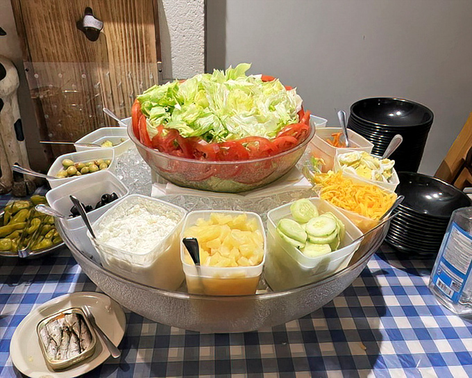 This isn't just a salad bar&mdash;it's a prelude to the main event. Fresh ingredients standing at attention, waiting to prepare your palate for the beef bonanza to come.