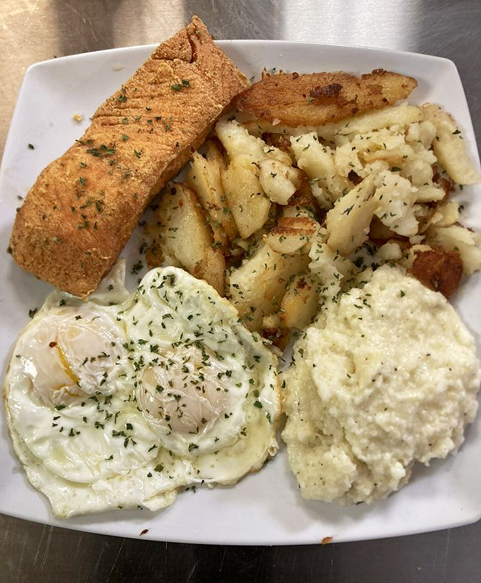 Breakfast of champions! Crispy fish, creamy eggs, and potatoes that look like they've been blessed by the comfort food gods.